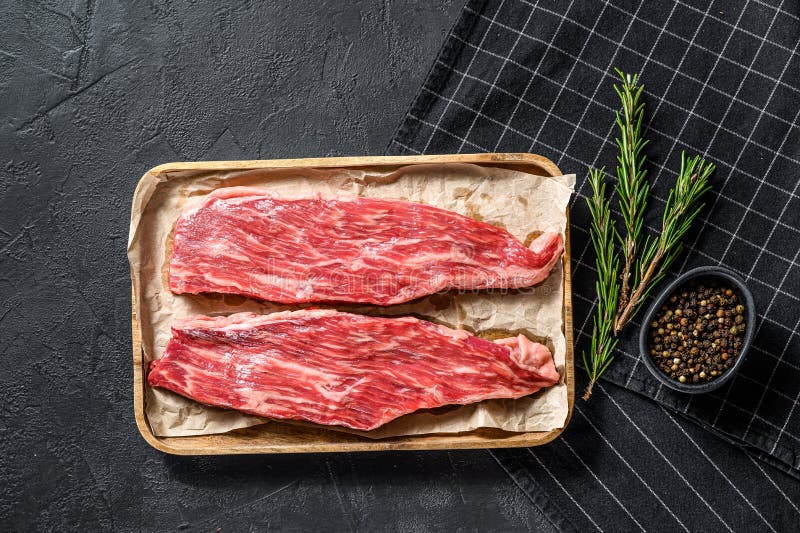 Raw Flank Steak. Fillet of Marbled Beef. Black Background Stock Image ...