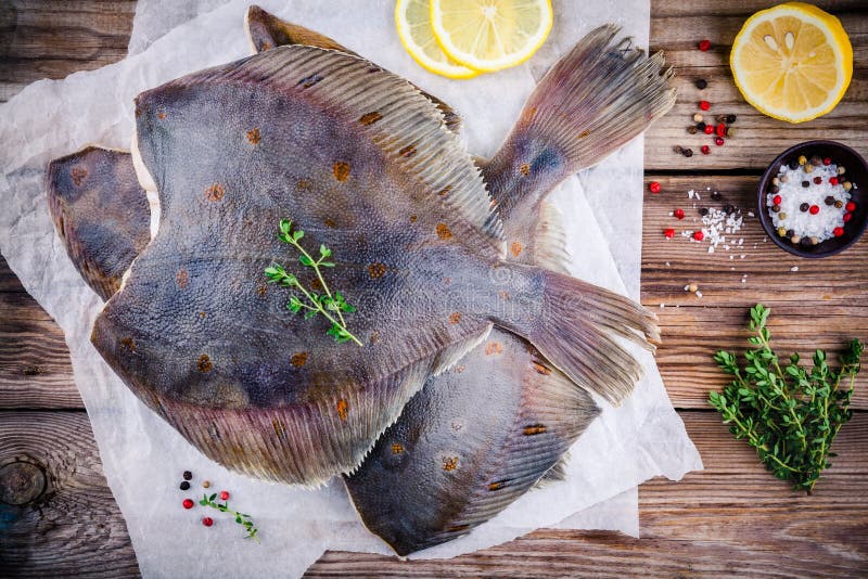 Raw Flounder Fish, Flatfish on Wooden Table Stock Image - Image of ...
