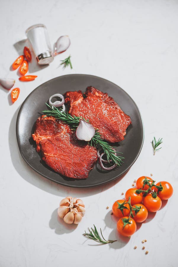 Raw Fresh Beef on White Stone Background, Top View Stock Photo - Image ...