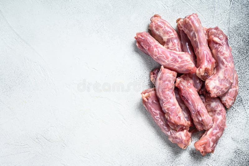 Raw Chicken Neck Meat, Offals. White Wooden Background Stock Photo ...