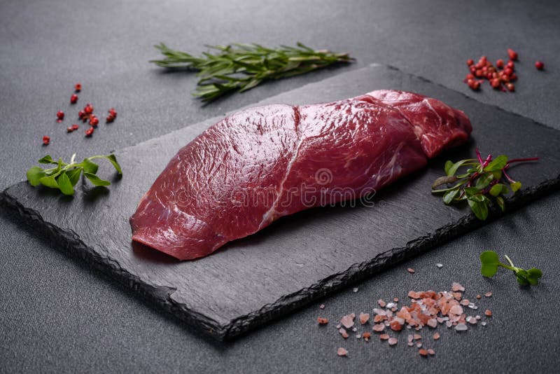 Raw Fresh Chuck Roll Steak with Herbs and Salt on a Cutting Board Stock ...