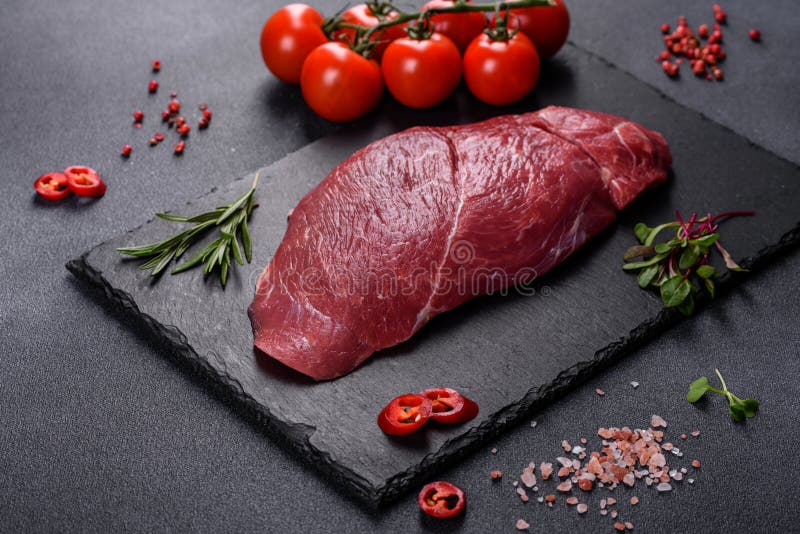 Raw Fresh Chuck Roll Steak with Herbs and Salt on a Cutting Board Stock ...