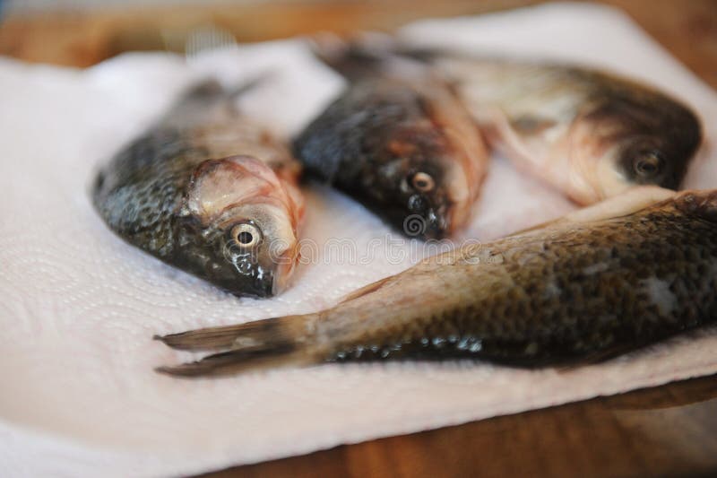 Raw Fresh Fish Whole on Cut Board. the Cooking Process. Stock Photo ...