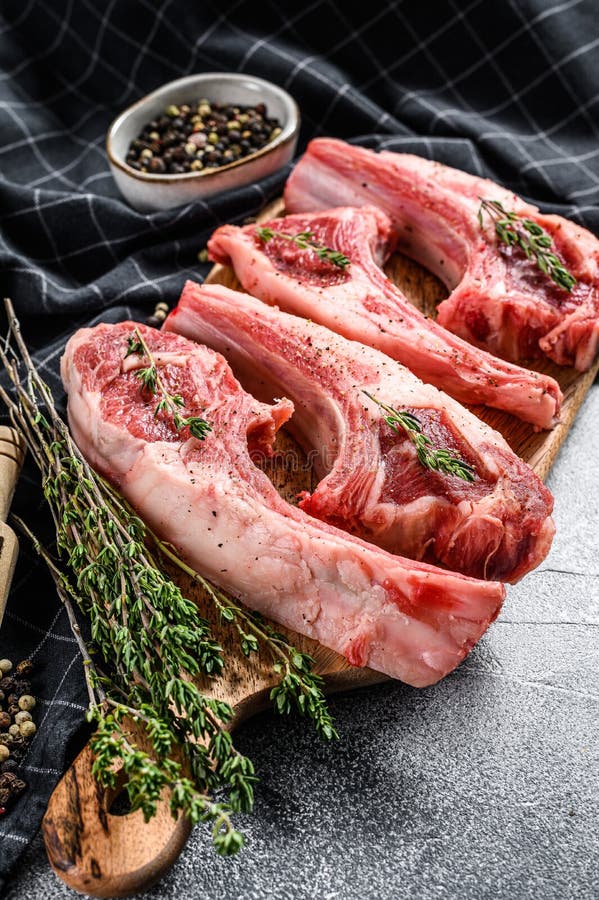 Fresh Raw Lamb Neck Meat Slices, Mutton Meat on a Rack with Herbs. Dark ...