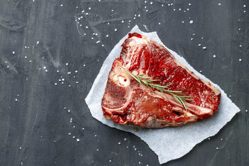 Raw Fresh Meat T-bone Steak with Spices on a Dark Background Stock ... Raw Fresh Meat T-bone Steak with Spices on a Dark Background Stock ...