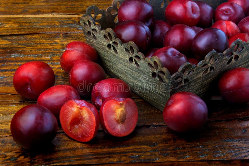Raw and Fresh Organic Plums Inside Rustic Fabric Wooden Box on Rustic ...