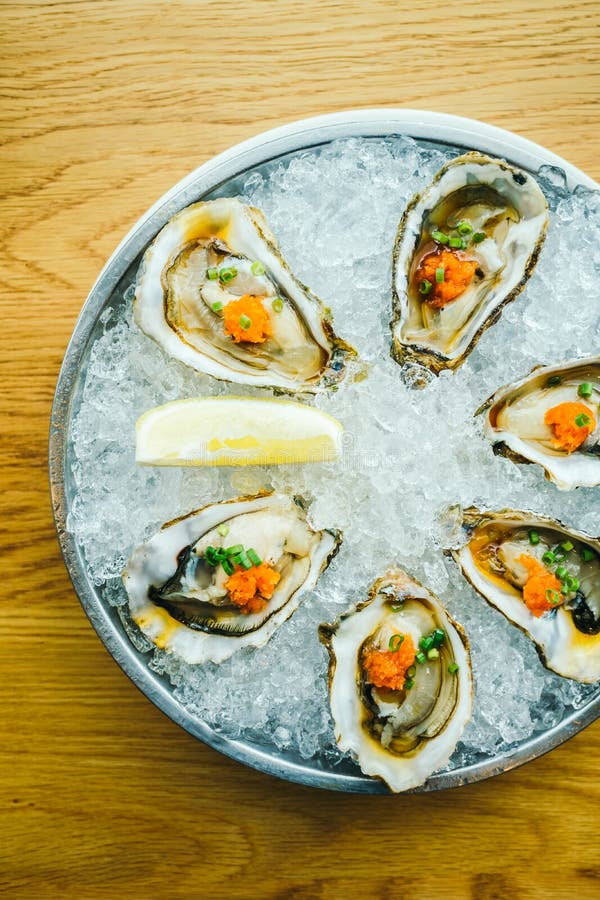 Raw and Fresh Oyster Shell with Lemon Stock Photo - Image of bivalve ...