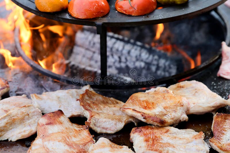 Raw Fresh Pieces of Meat are Placed on a Cast Iron Grill To Be Grilled ...