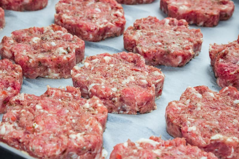 Raw Fresh Pork Cutlets in the Shape of a Flower on Parchment Paper ...