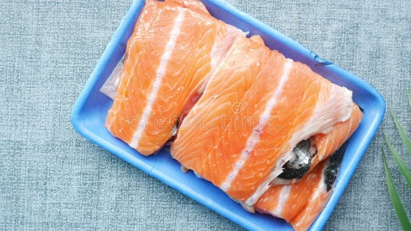 Raw, Fresh Salmon Steak on a Plastic Packet on Table Stock Video ...