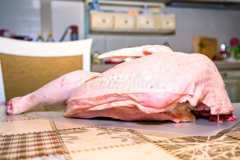 Uncooked Raw Turkey Necks Meat on a Butcher Wooden Board with Cleaver ...