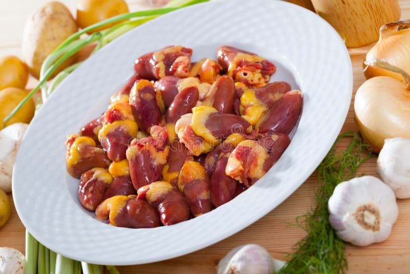 Raw Freshness Uncooked Chicken Hearts at Plate on Table Stock Photo ...