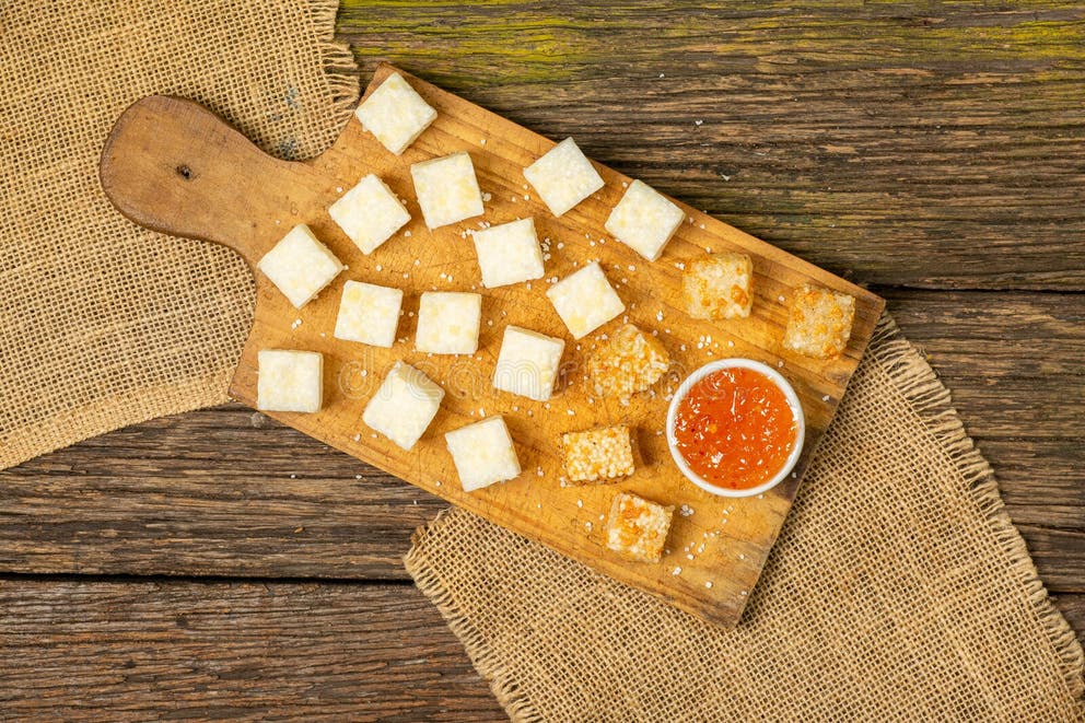 Raw and Fried Tapioca Cubes (Dadinhos De Tapioca) on Top of Rustic ...