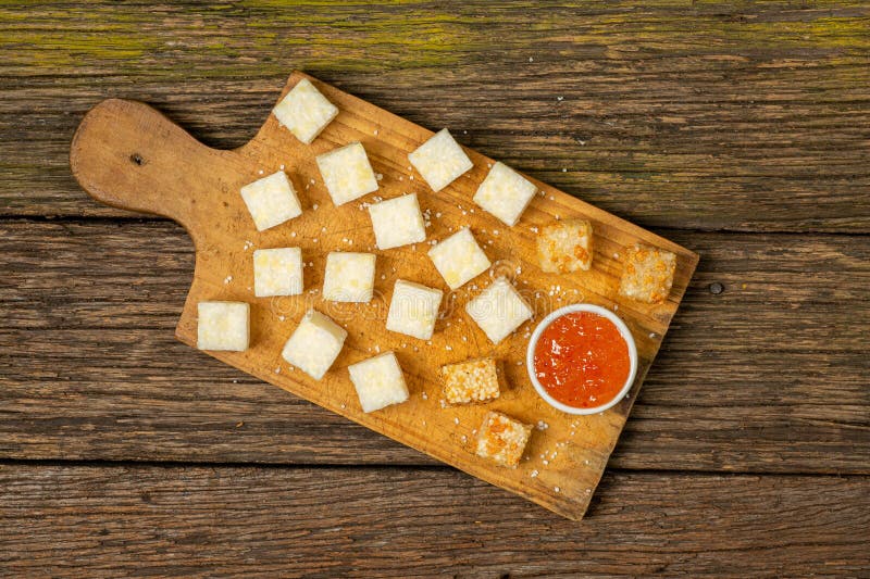 Raw and Fried Tapioca Cubes (Dadinhos De Tapioca) on Top of Rustic ...