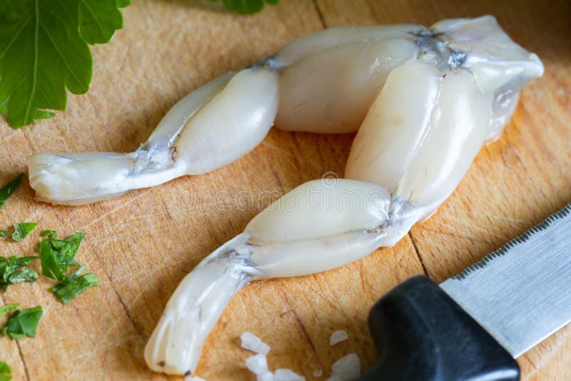 Raw Frog Legs on Cutting Board in the Kitchen Stock Image - Image of ...