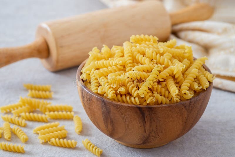 Raw Fusilli Pasta in Wooden Bowl Stock Photo - Image of food, fresh ...