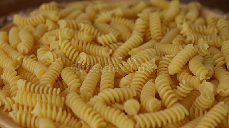 Raw Fusilli Spiral Spaghetti Pasta Pattern Background. Stock Footage ...