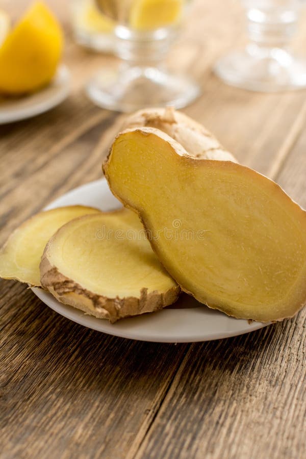 Raw ginger on wood table stock image. Image of plant - 66645321