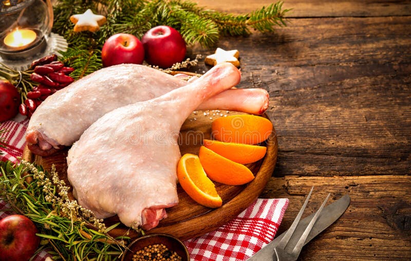 Raw Goose Legs with Herbs on Cutting Board Stock Image - Image of ...