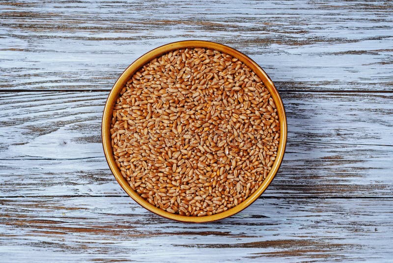 Raw grain in a plate stock photo. Image of grains, crop - 129673024