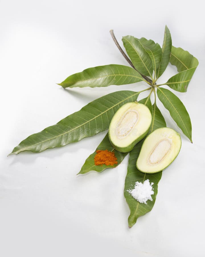 Raw Green Mango Slices on Leaves with Salt and Pepper Stock Photo ...