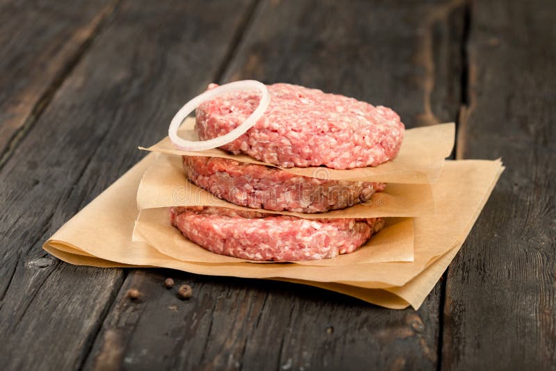 Raw Ground Beef Meat Cutlets with Onion Ring Stock Photo - Image of ...