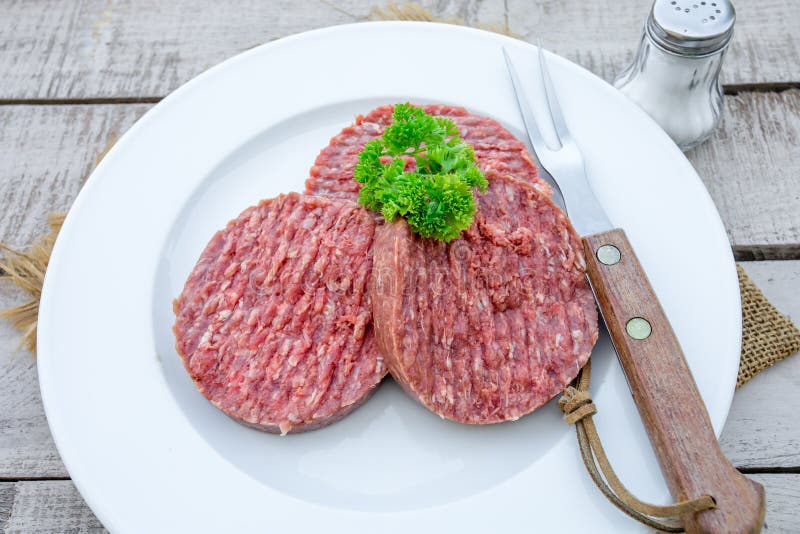 Raw ground beef on a plate stock image. Image of healthy - 161381461