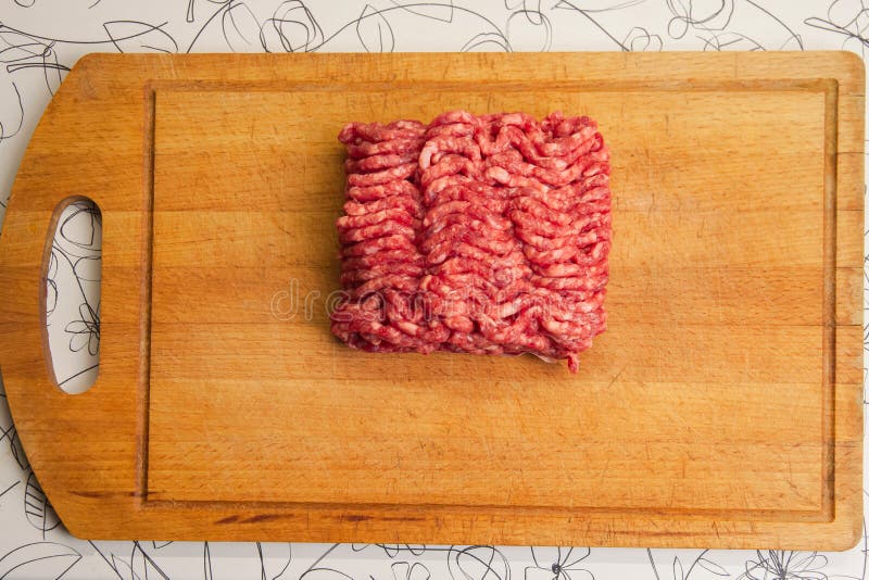 Raw Ground Beef in the Shape of a Square on a Cutting Board Stock Image ...