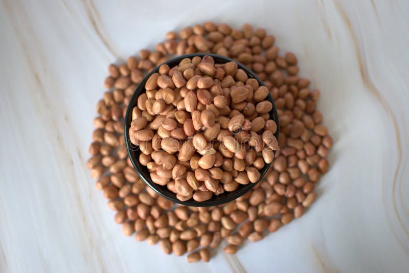 Raw Groundnuts or Peanut Kernel in an Earthen Bowl Stock Photo - Image ...