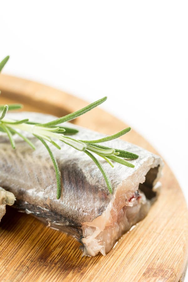 Raw Hake Fish with Rosemary and Copy Space White Background Stock Photo ...