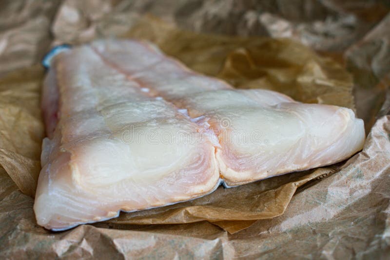 Raw Halibut Fillet on Brown Paper Stock Image - Image of close, brown ...