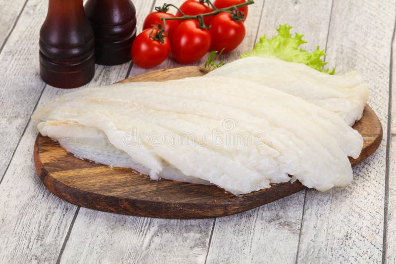 Raw halibut fillet stock photo. Image of cutting, fish - 142980654