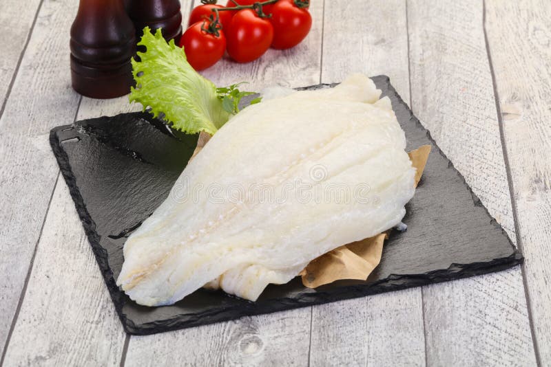 Raw halibut fillet stock image. Image of black, food - 150886413