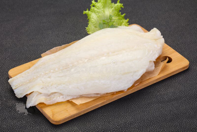 Raw halibut fillet stock image. Image of kitchen, board - 154427803