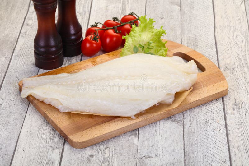 Raw halibut fillet stock photo. Image of black, delicious - 165038464