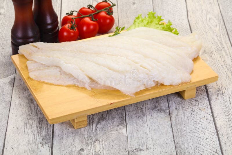 Raw halibut fillet stock image. Image of filet, board - 177736261