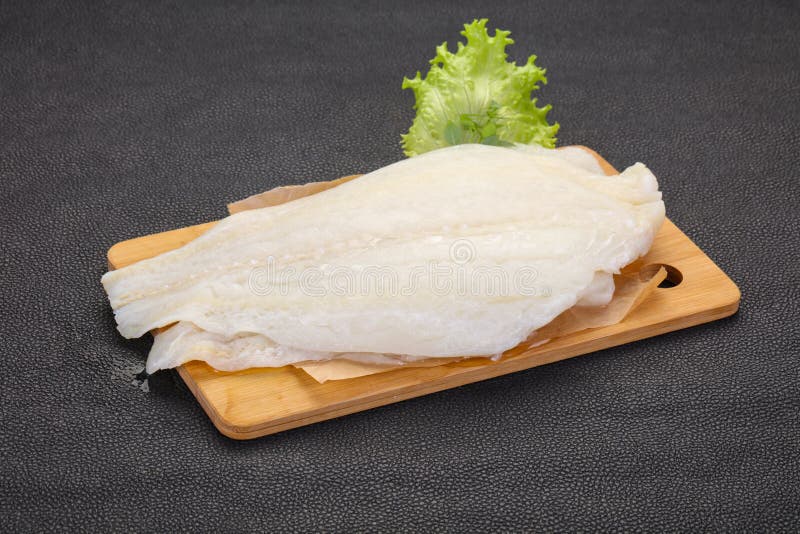 Raw halibut fillet stock photo. Image of eating, black - 188550184