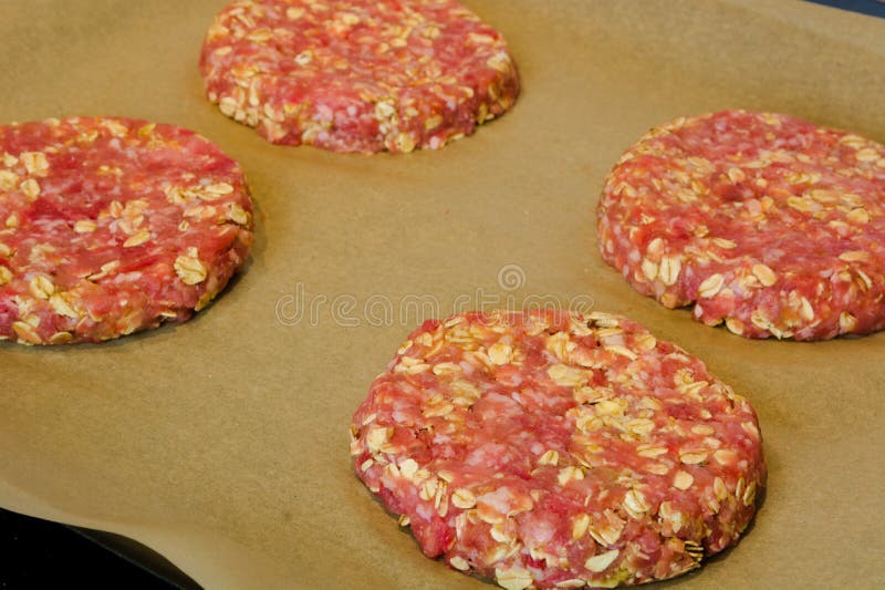 Raw Hamburger on Oven Paper. Home Made Concept Stock Photo - Image of ...