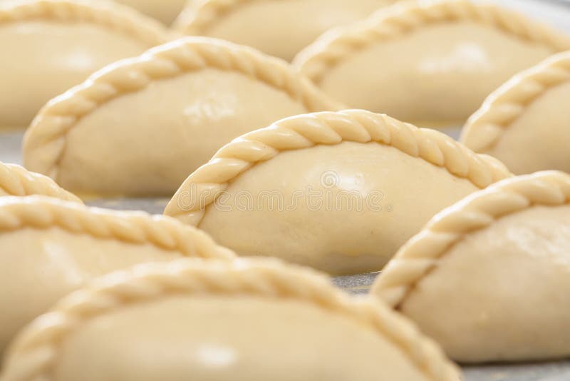 Raw Homemade Pastries on Baking Paper Ready To Bake. Stock Photo ...