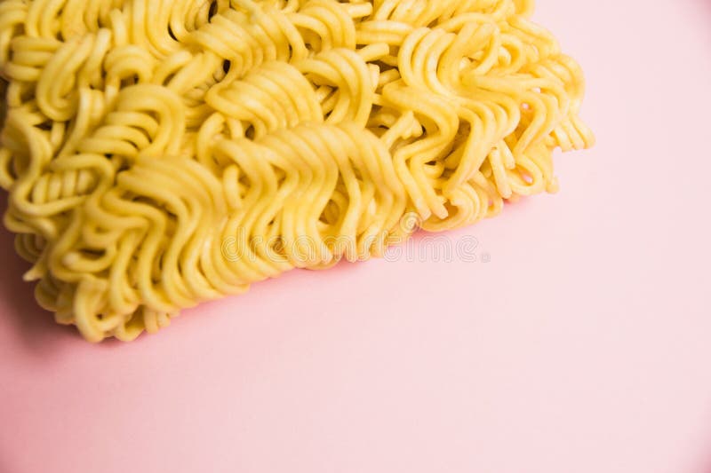Raw Instant Noodles Close-up on Pink Paper Background with Copy Space ...