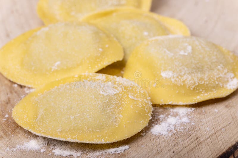 Raw italian tortelli pasta stock photo. Image of noodles - 176368790