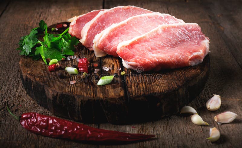 Raw Juicy Meat Steaks Ready for Roasting on a Black Chalk Board Stock ...