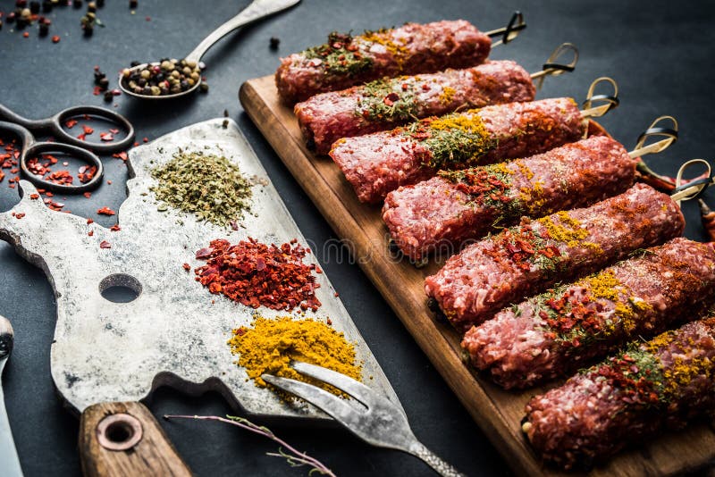 Raw kebab with spices stock photo. Image of condiment - 148340622