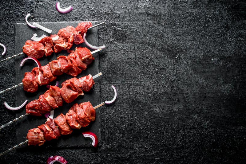 Raw Kebab on a Stone Board with Pieces of Onions Stock Image - Image of ...