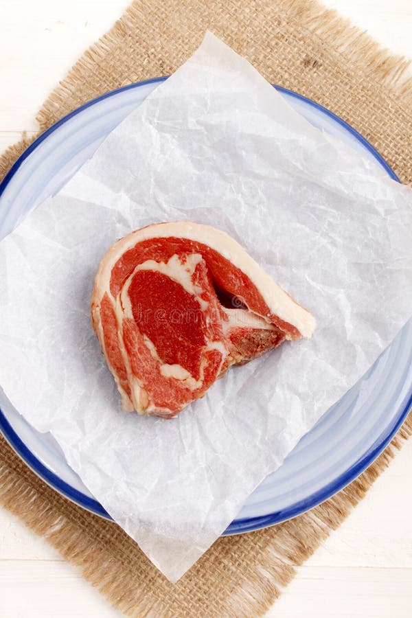 Raw Lamb Chop with Kitchen Paper on a Plate Stock Photo - Image of ...