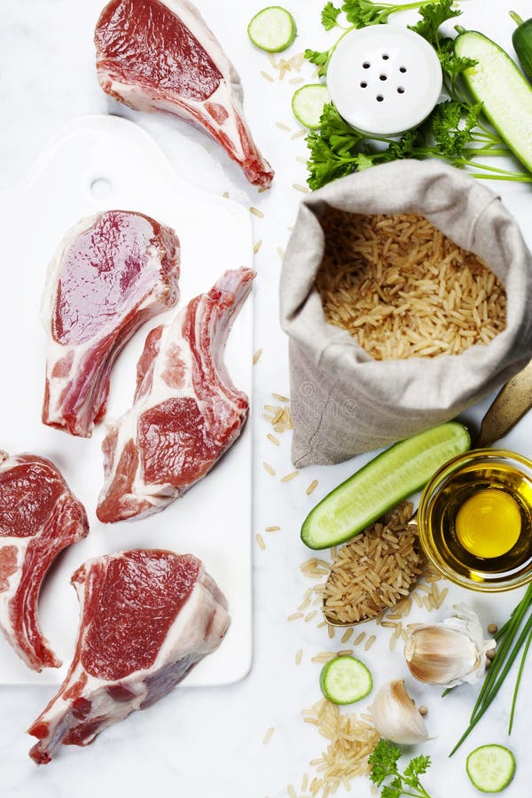 Raw Lamb Chops and Brown Rice Stock Image - Image of lamb, parsley ...