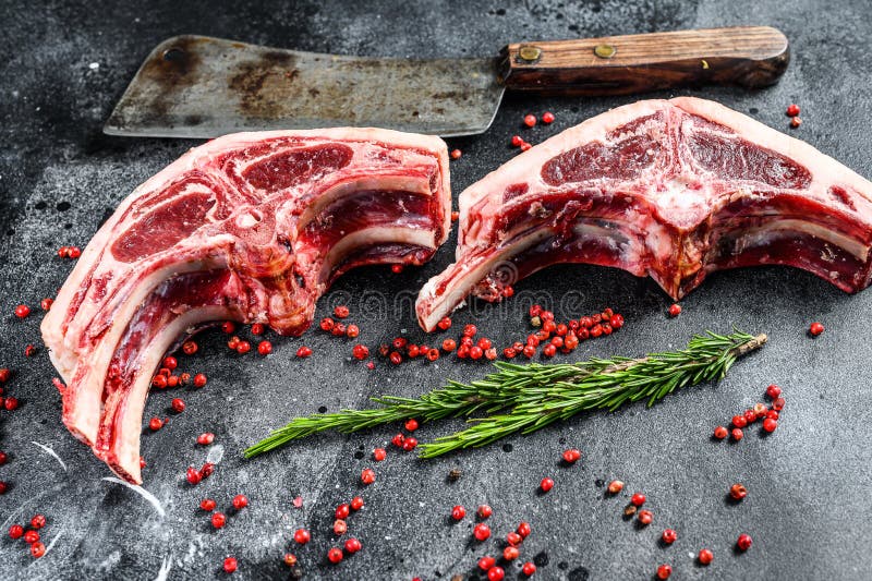 Raw Lamb Chops Fresh Cut with Meat Cleaver. Black Background Stock ...