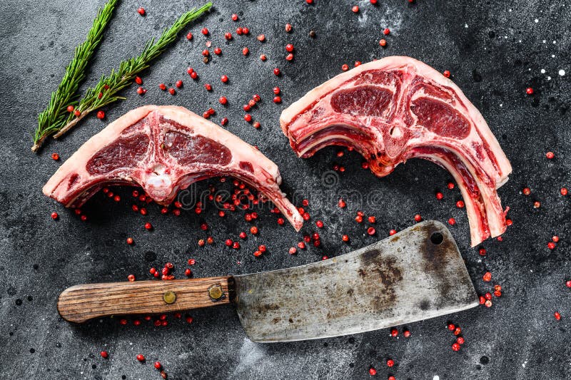 Raw Lamb Chops Fresh Cut with Meat Cleaver. Black Background Stock ...