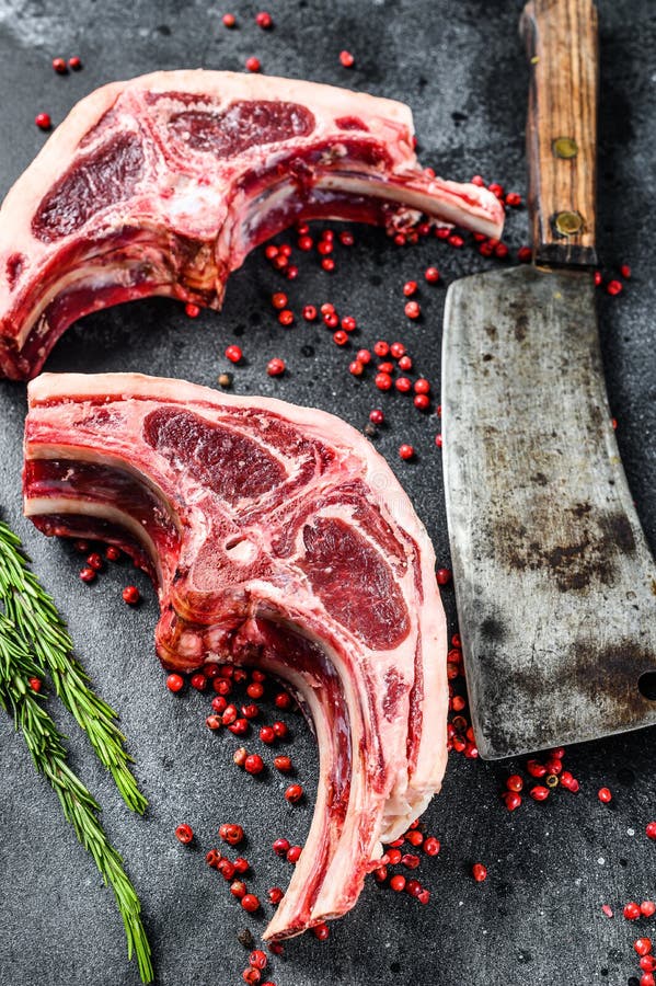 Raw Lamb Chops Fresh Cut with Meat Cleaver. Black Background Stock ...