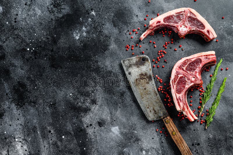 Raw Lamb Chops Fresh Cut with Meat Cleaver. Black Background. Top View ...